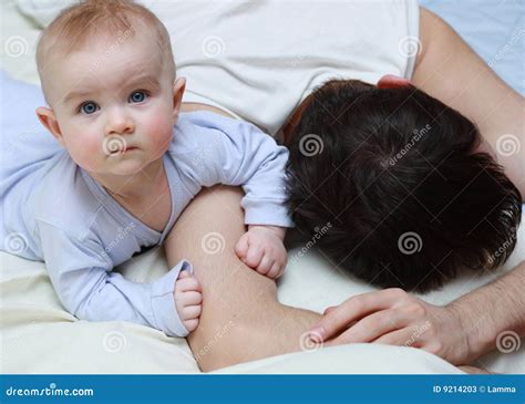 Baby And Sleeping Father Stock Photos Image