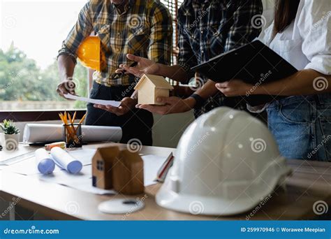 Architect Man Working With Blueprints For Architectural Plan Engineer Sketching A Construction