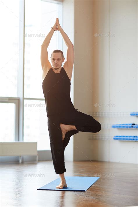 Man Doing Tree Pose Stock Photo By Seventyfourimages PhotoDune
