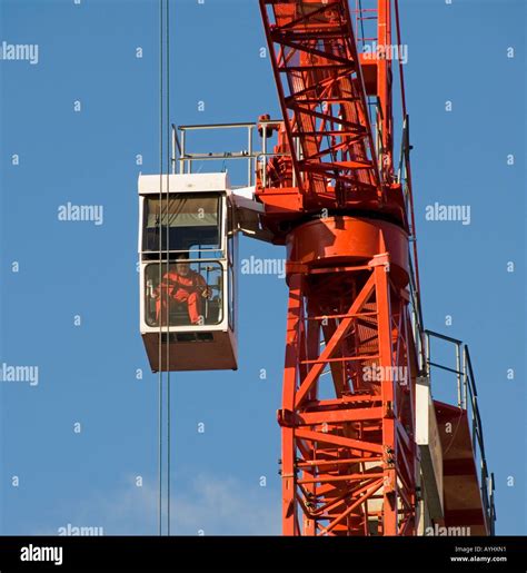 Tower Crane Mast Showing Driver In Control Pod With Crane Cables And