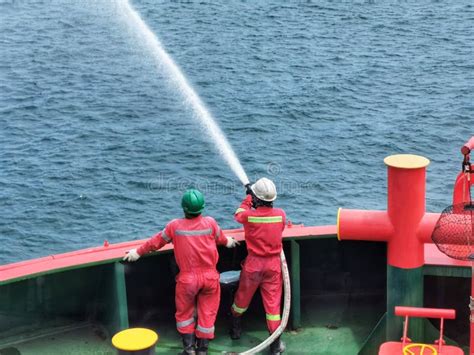 Marine Crew Testing A Fire Hydrant Omboard Marine Vessel During