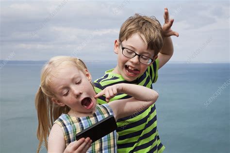 Brother And Sister Taking Selfie Stock Image F0128598 Science