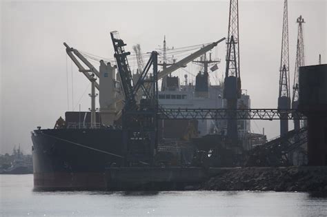Premium Photo Container Ship At A Harbor