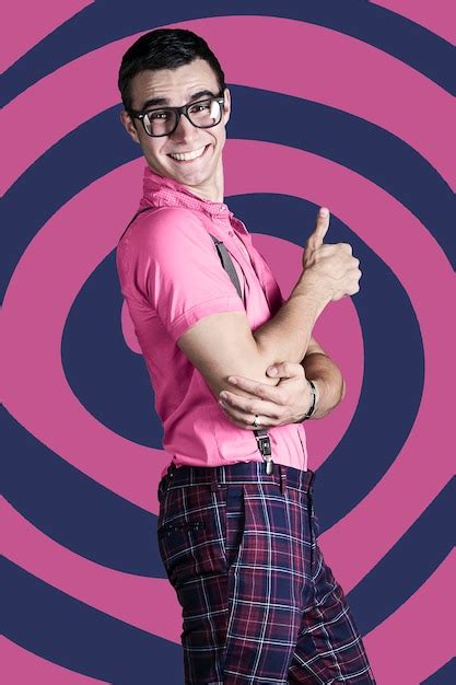 Premium Photo Portrait Of Smiling Nerd Gesturing Thumbs Up Against