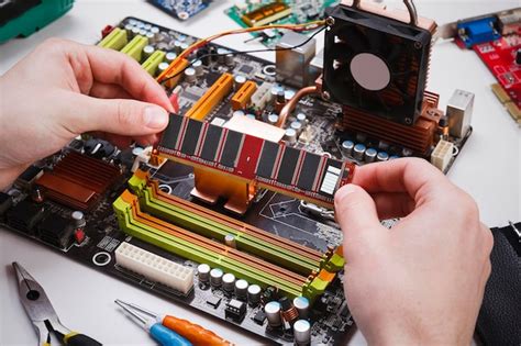 Premium Photo Technician Plug In Cpu Microprocessor To Motherboard