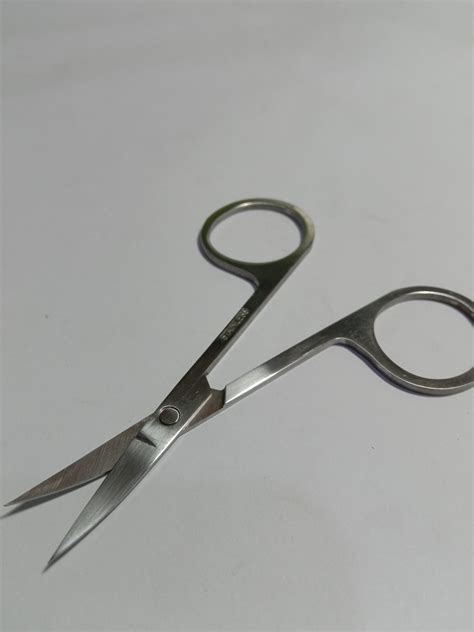 Cuticle Scissor Beauty Concept