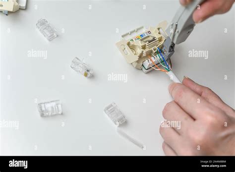 Installing A Wall Ethernet Socket Connecting Wires To An Socket Stock