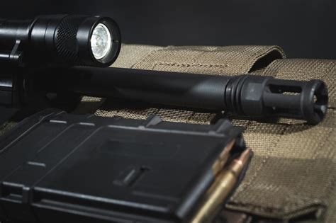 Premium Photo Tactical Weapon Flashlight Mounted On Rifle Ar15 Loaded