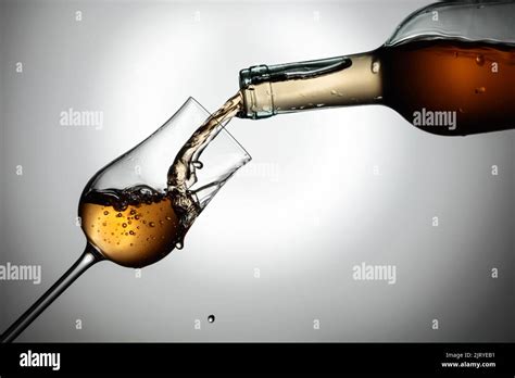 Digestive Tulip Of Premium Alcohol The Drink Is Poured From A Bottle