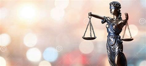 Symbol Of Justice Holding Scales With A Blindfold Representing