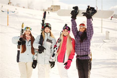 Group Of Girls Spend Time Together Skiing In Mountains Stock Image