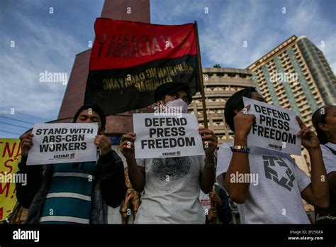 Protesters Hold Placards During A Rally On Press Freedom Following
