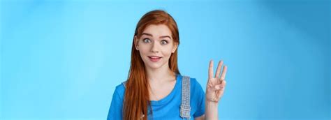 Premium Photo Surprised Cute Redhead Caucasian Girl Show Number Three