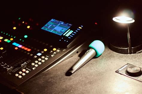 Premium Photo Closeup Shot Of A Microphone Near An Equalizer