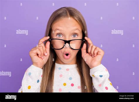 Photo Of Excited Shocked Nerd Small Lady Open Mouth Wear Spectacles Dotted Pajama Isolated
