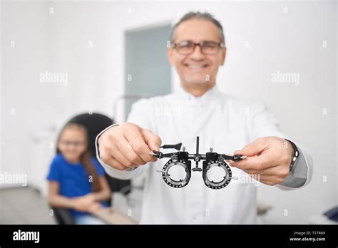 Close Up Of Eye Test Glasses Doctor Ophthalmologist In White Medical
