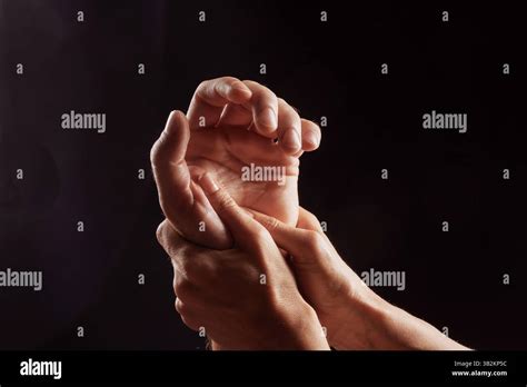 Close Up Of Hand Reflexology Massage Therapist Pressing Acupressure