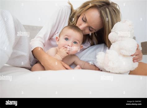 Mother With Baby Babe And Stuffed Toy Stock Photo Alamy