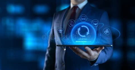 Businessman Holding Device With Update Icons On Screen Software