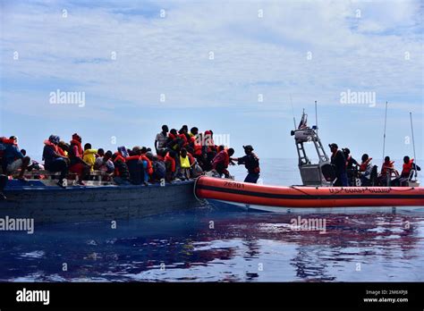 Haitians Are Transferred From A Grossly Overloaded Unsafe Vessel To