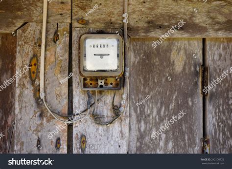 Old Electric Meter On Wooden Building