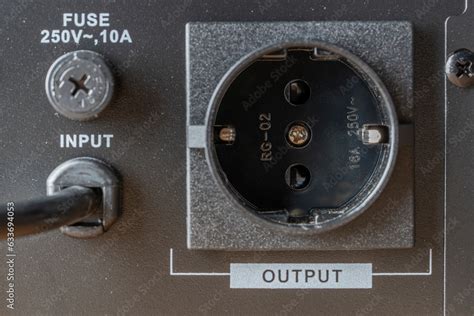 Electrical Socket Output And Input Cable On The Back Of The Uninterruptible Power Supply