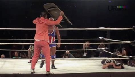 Riff Raff Interferes In A Wrestling Match Between Kurt Angle And Rey