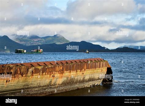 View Over A Rusty Derelict Navy Hull Of A Tug And Barge Traveling On