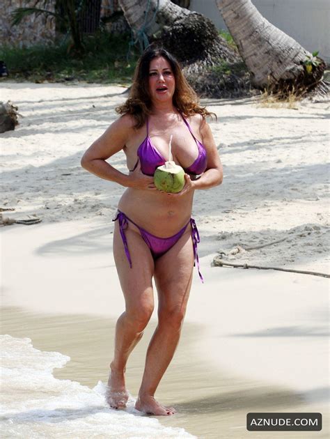 Lisa Appleton Sexy Relaxing On The Beach Enjoying A Coconut Drink While