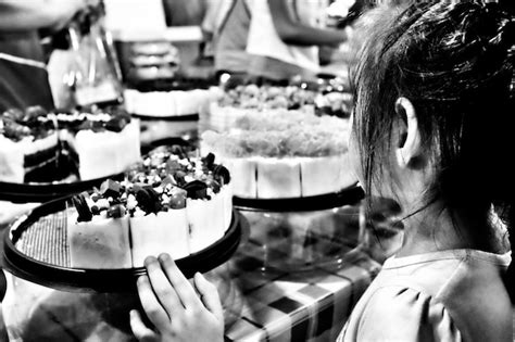 Premium Photo Cropped Image Of Girl Looking At Cake