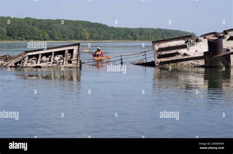 Kayaker Aleksandar Bzdusok Paddles By The Wreckage Of A Wwii German