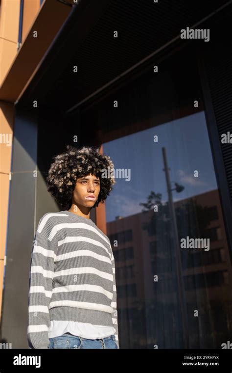 A Mixed Race Woman With Vitiligo Stands Outside A University Building