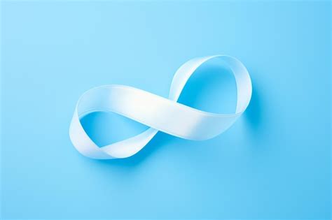 Premium Photo White Curled Ribbon Decoration On Blue Background