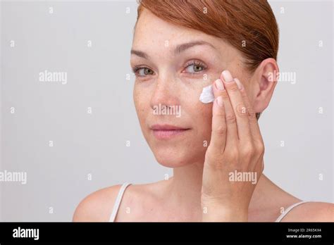 Portrait Of Cropped Caucasian Middle Aged Woman Face With Freckles And