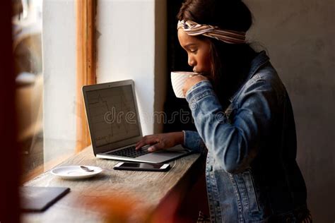 Coffee Helps Boost My Productivity An Attractive Young Woman Drinking
