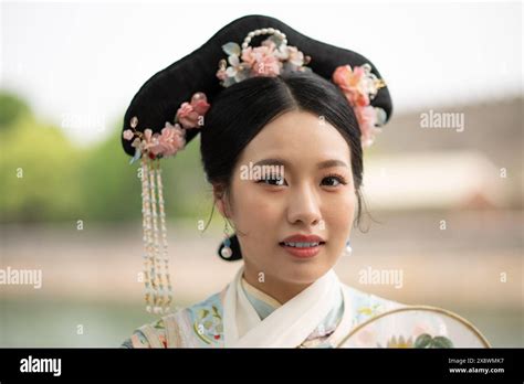 Portrait Of Beautiful Young Chinese Ladies Wearing Chinese Traditional