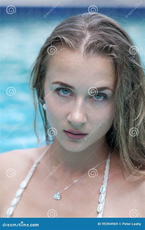 Attractive Young Women Modeling Various Outfits At A Pool Stock Image