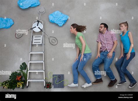 Man And Women Blowing Windmill Stock Photo Alamy