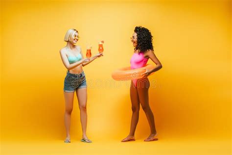 Woman Holding Cocktail Glasses Near African Stock Image Image Of