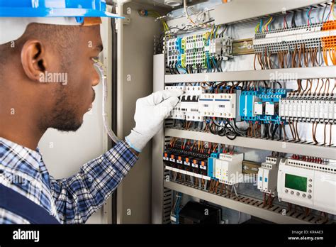 Man Testing Fuse Box Hi Res Stock Photography And Images Alamy