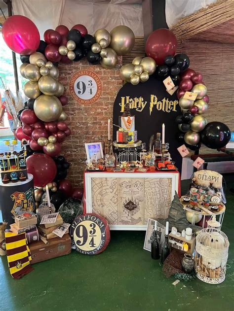 A Harry Potter Birthday Party With Balloons And Decorations