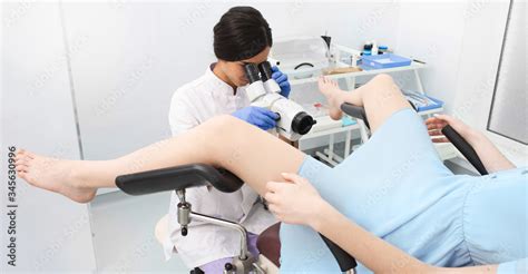 Women Having A Cervix Exam By Her Gynecologist Lying On A
