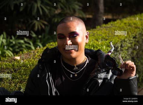 A Hispanic Non Binary Person Posing While Traveling In Europe Stock
