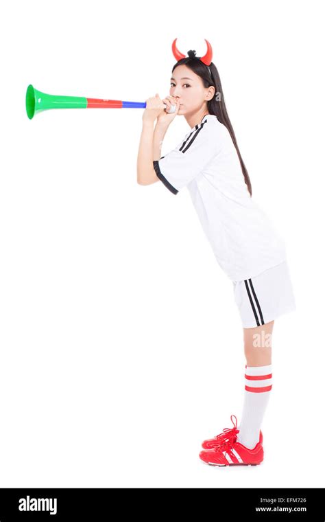 Uniformed Cheerleader A Pose With A Megaphone Isolated On White Stock