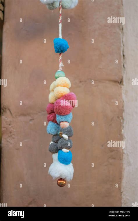 Colorful Fuzzy Balls Festive Multi Colored Fuzzy Balls Threaded On Thin Rope And Hanging With