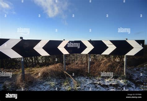 Arrow Symbols On Sharp Bend Warning Drivers On Country Road Yorkshire