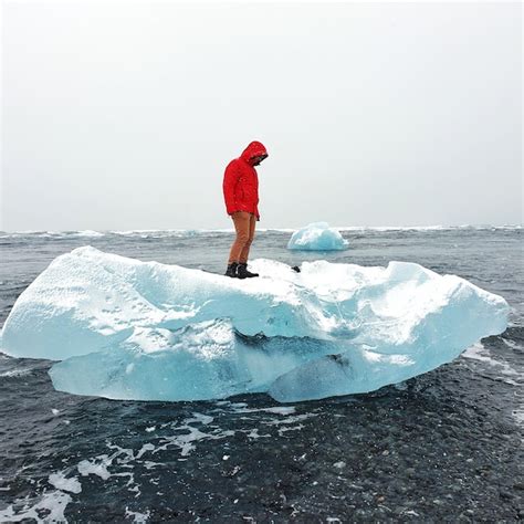 Premium Photo Woman Walking On Frozen Sea Against Sky