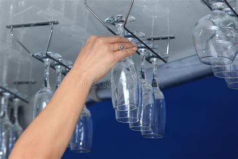 Barman S Hand Gives Empty Glasses From The Bar Shel Stock Photo Image