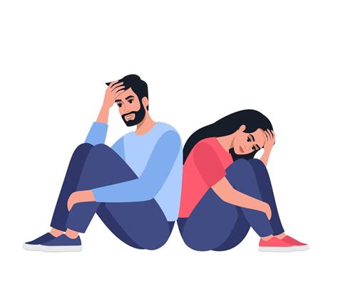 Exhausted Man And Woman Sitting On The Floor Hugging Their Knees