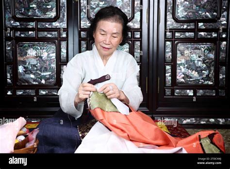A Master Of Traditional Korean Clothing A Hanbok Expert Is Sewing For